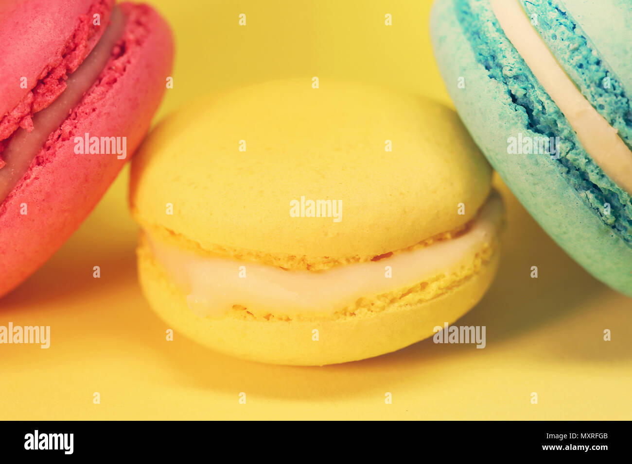 Bright food photography of macroons on yellow background Stock Photo ...