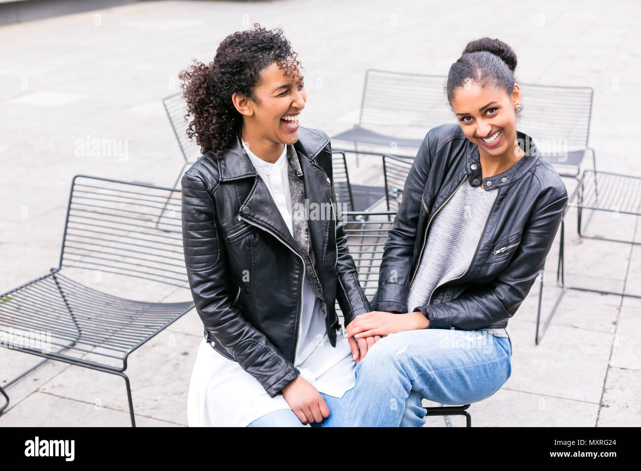 Two Girls Whispering Park High Resolution Stock Photography and Images ...