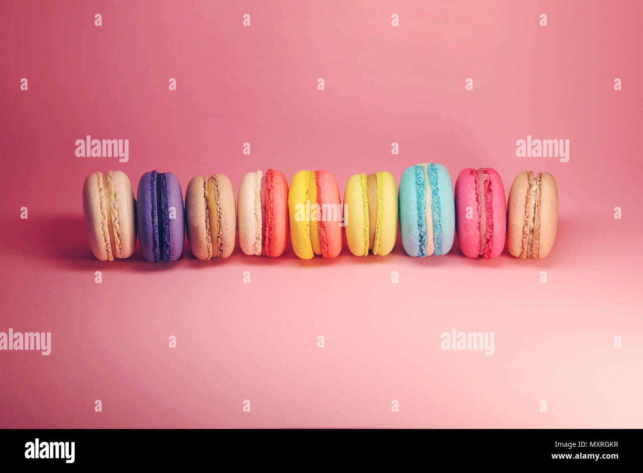 Bright food photography of macroons on pink background Stock Photo - Alamy