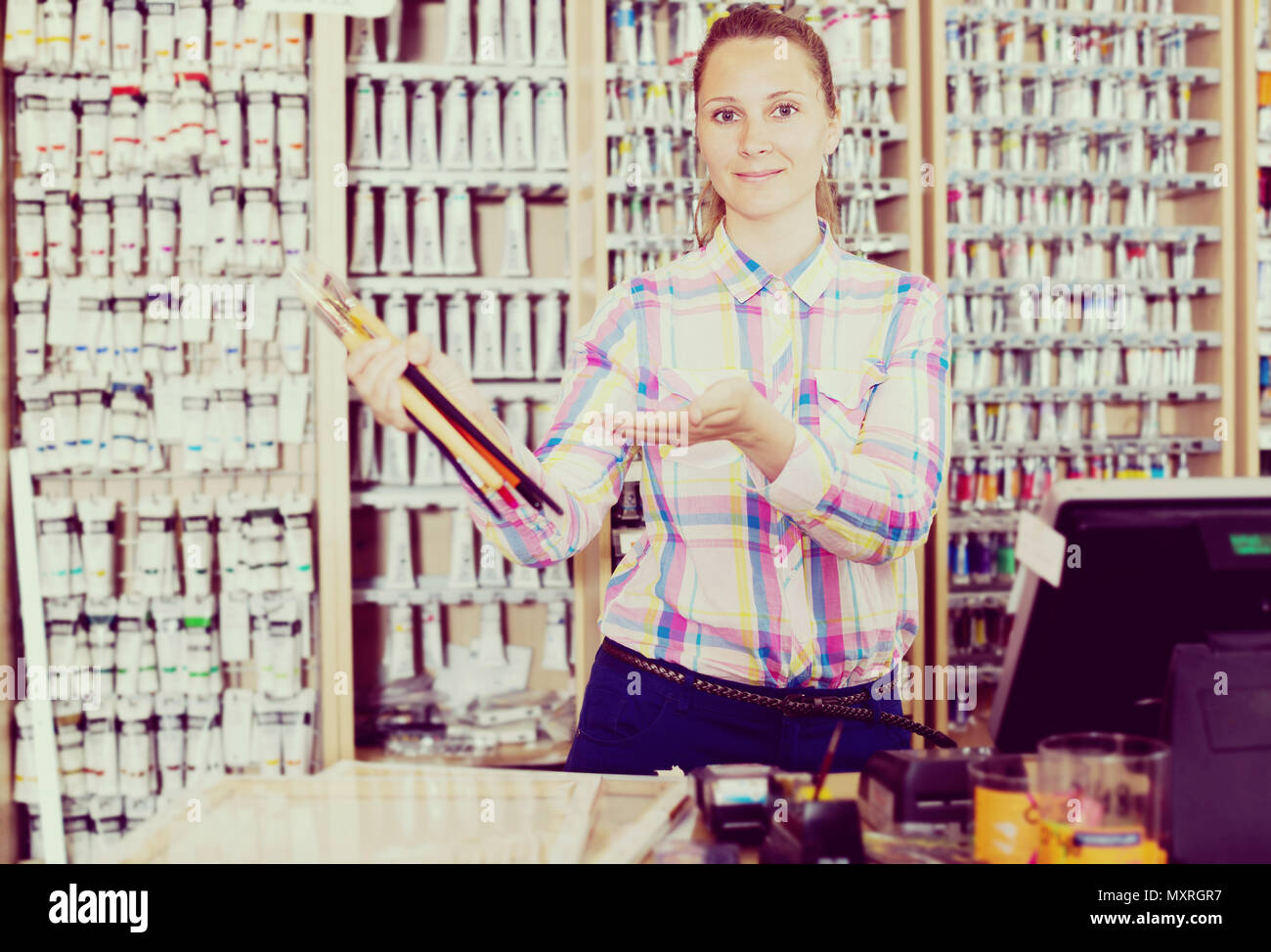 Young seller posing counter hi-res stock photography and images - Alamy