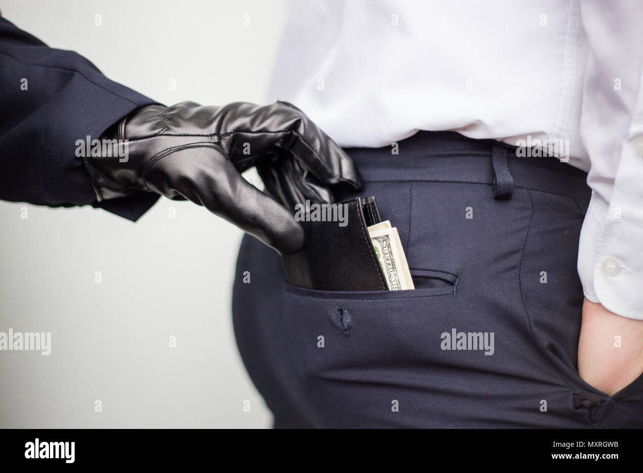 Hand pickpocket hi-res stock photography and images - Alamy