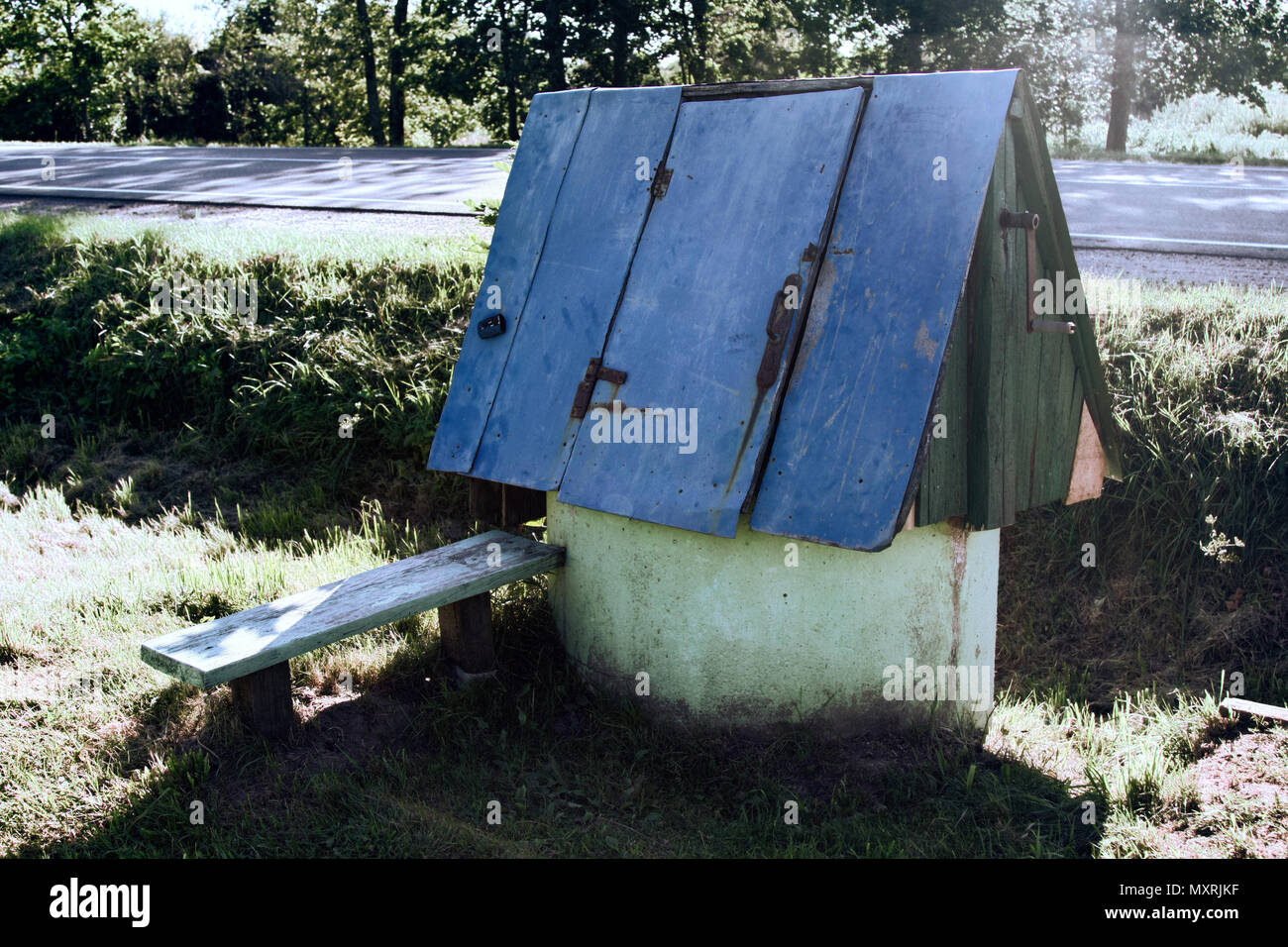 community well in Russian village in background of garden and poor ...