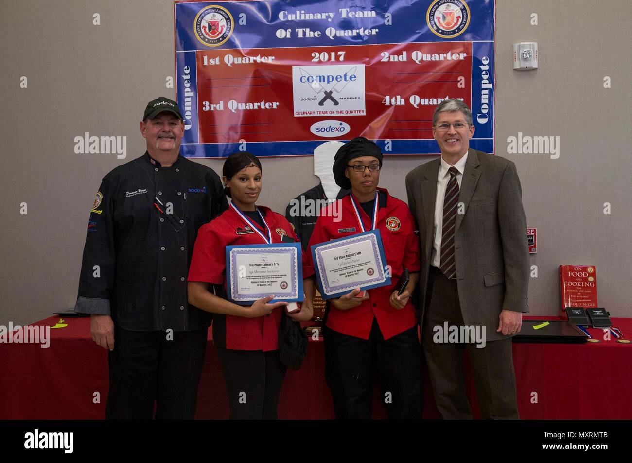 U.S. Marine Corps Sgt. Shevonne Guiterrez, center left, and Cpl ...