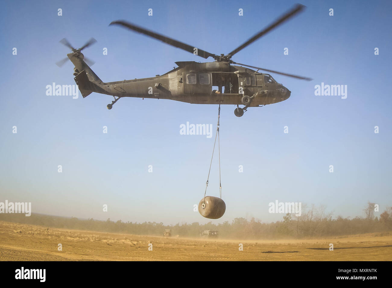 A crew chief with 82nd Combat Aviation Brigade, 82nd Airborne Division ...