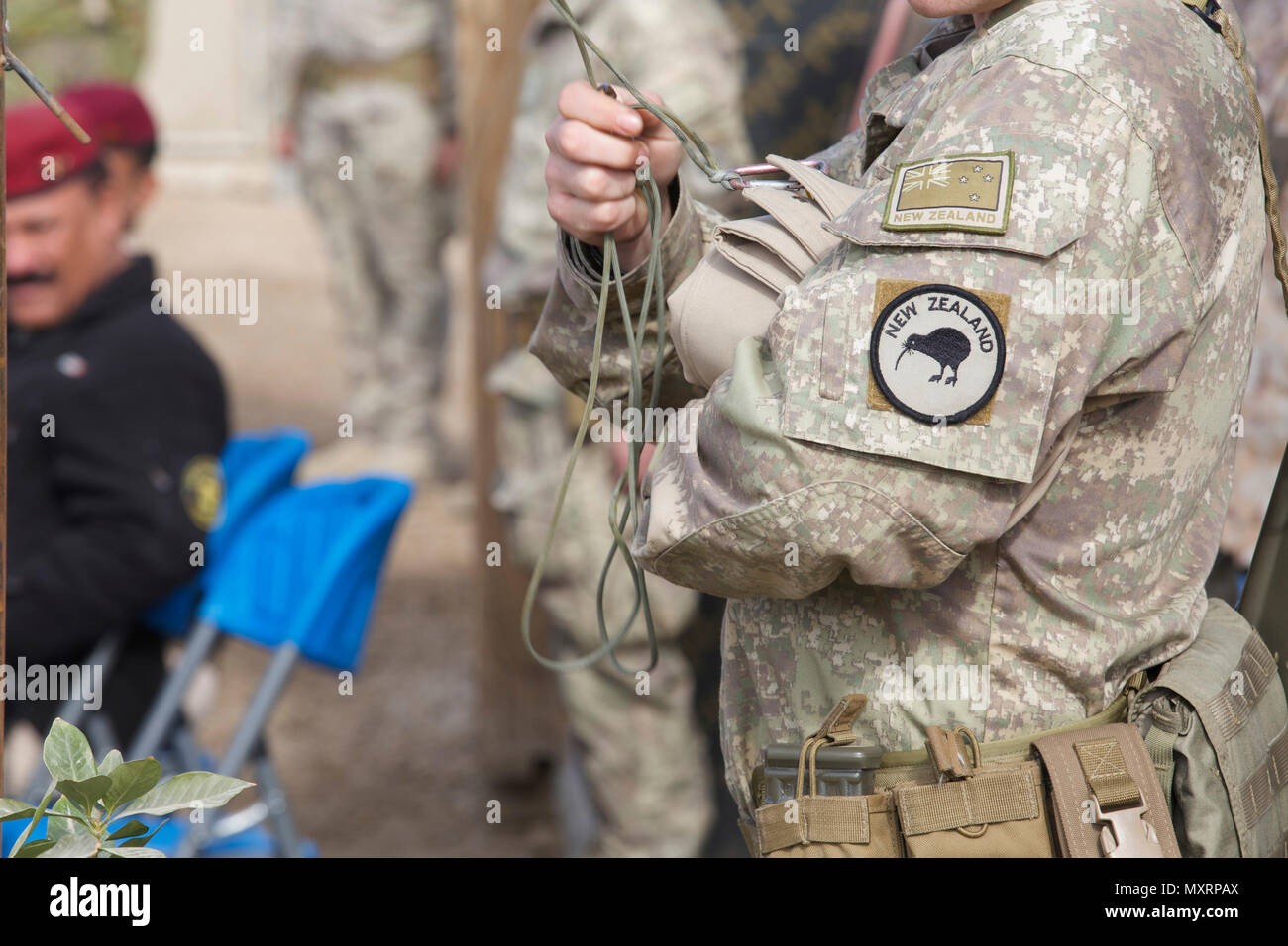 A New Zealand soldier from Task Group Taji prepares to raise the Task ...