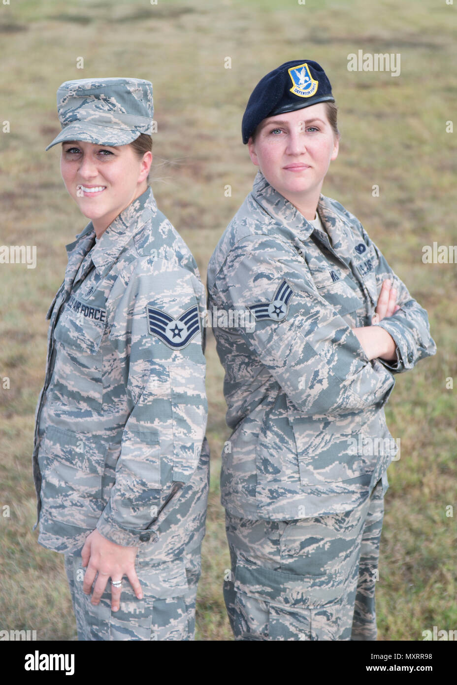 Senior Airman Kaley Weir (right), 802nd Security Forces Squadron corrections specialist, and ...