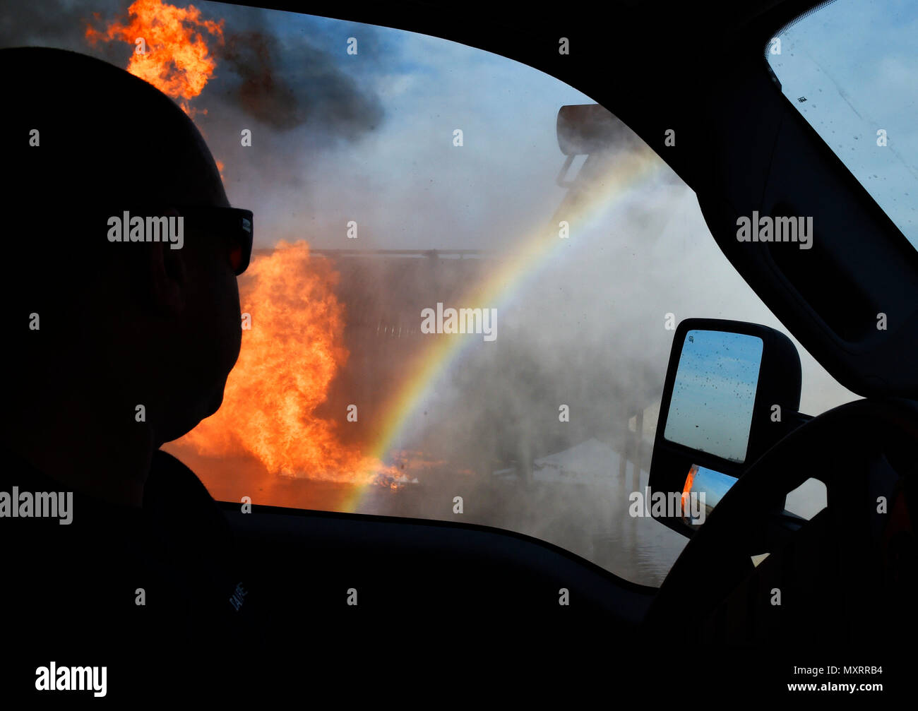 A firefighter uses a rapid intervention vehicle to respond to an ...