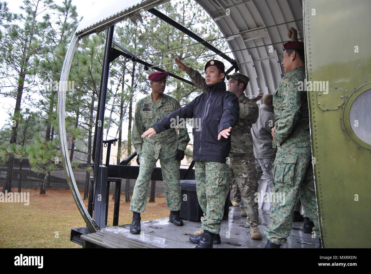 Poh Jing Song, a Singapore Army jump master, performs jump master ...