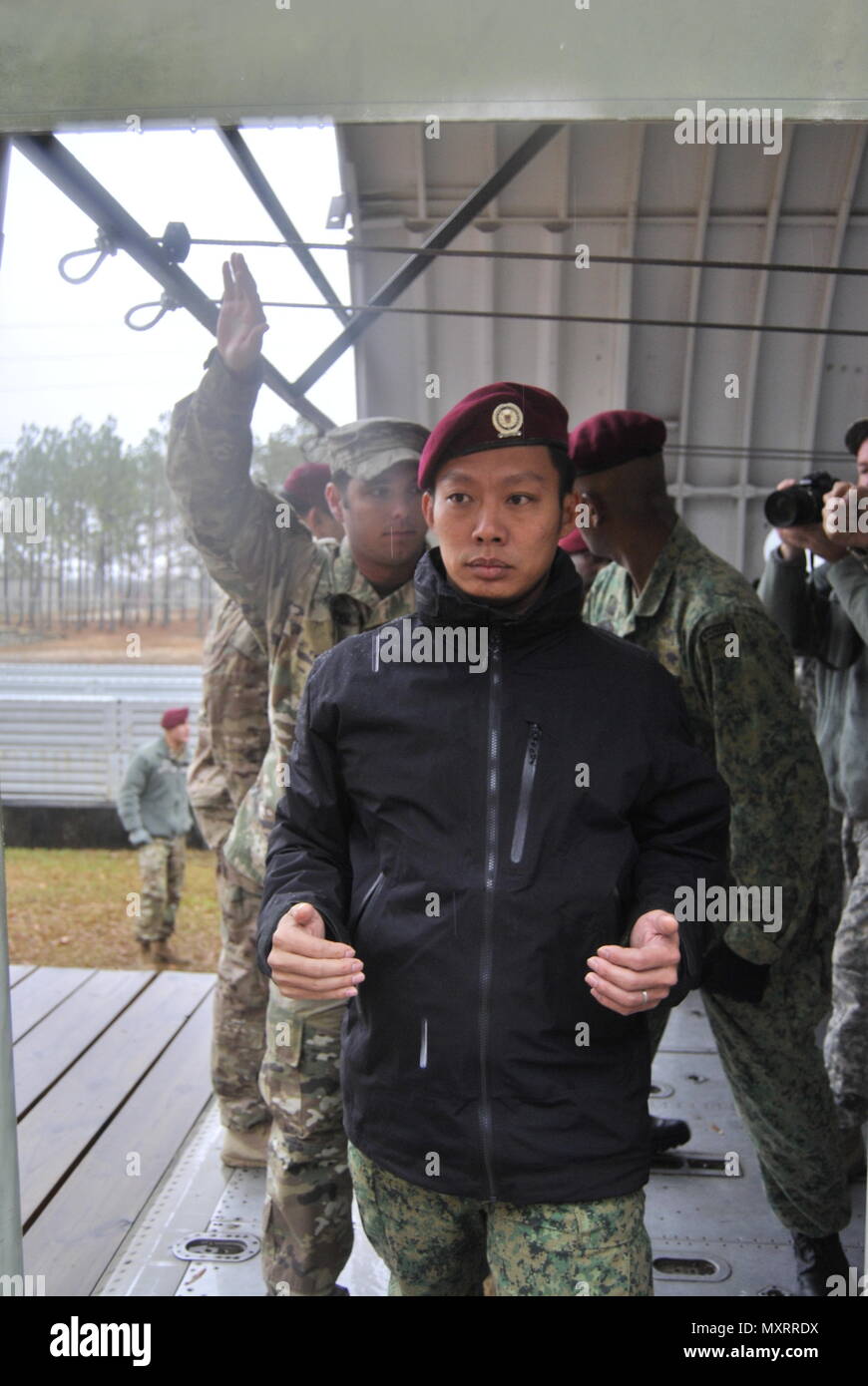 Poh Jing Song, a Singapore Army jump master, performs jump master ...