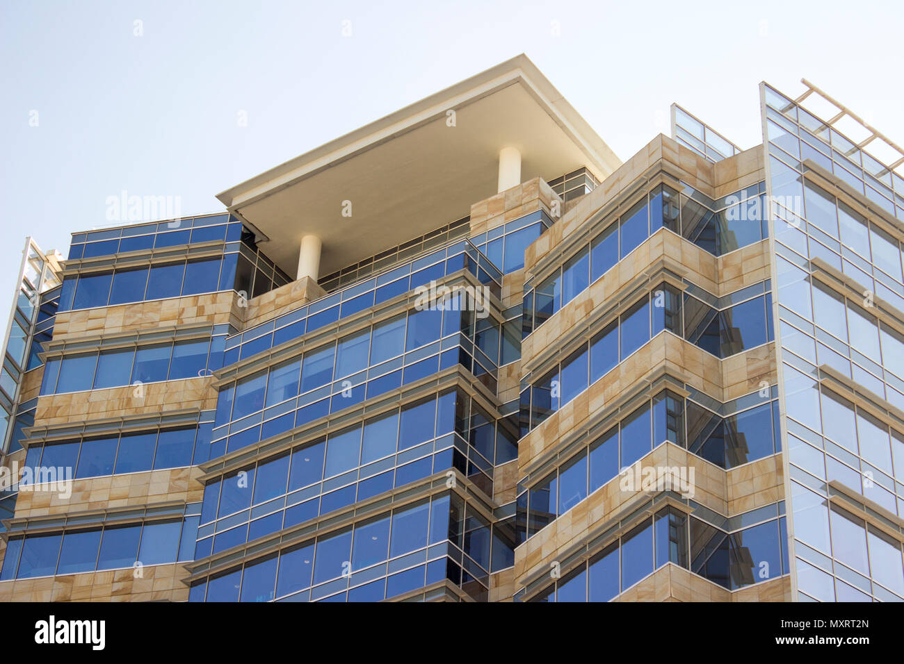 Side view of a modern corporate building with a terrace Stock Photo - Alamy