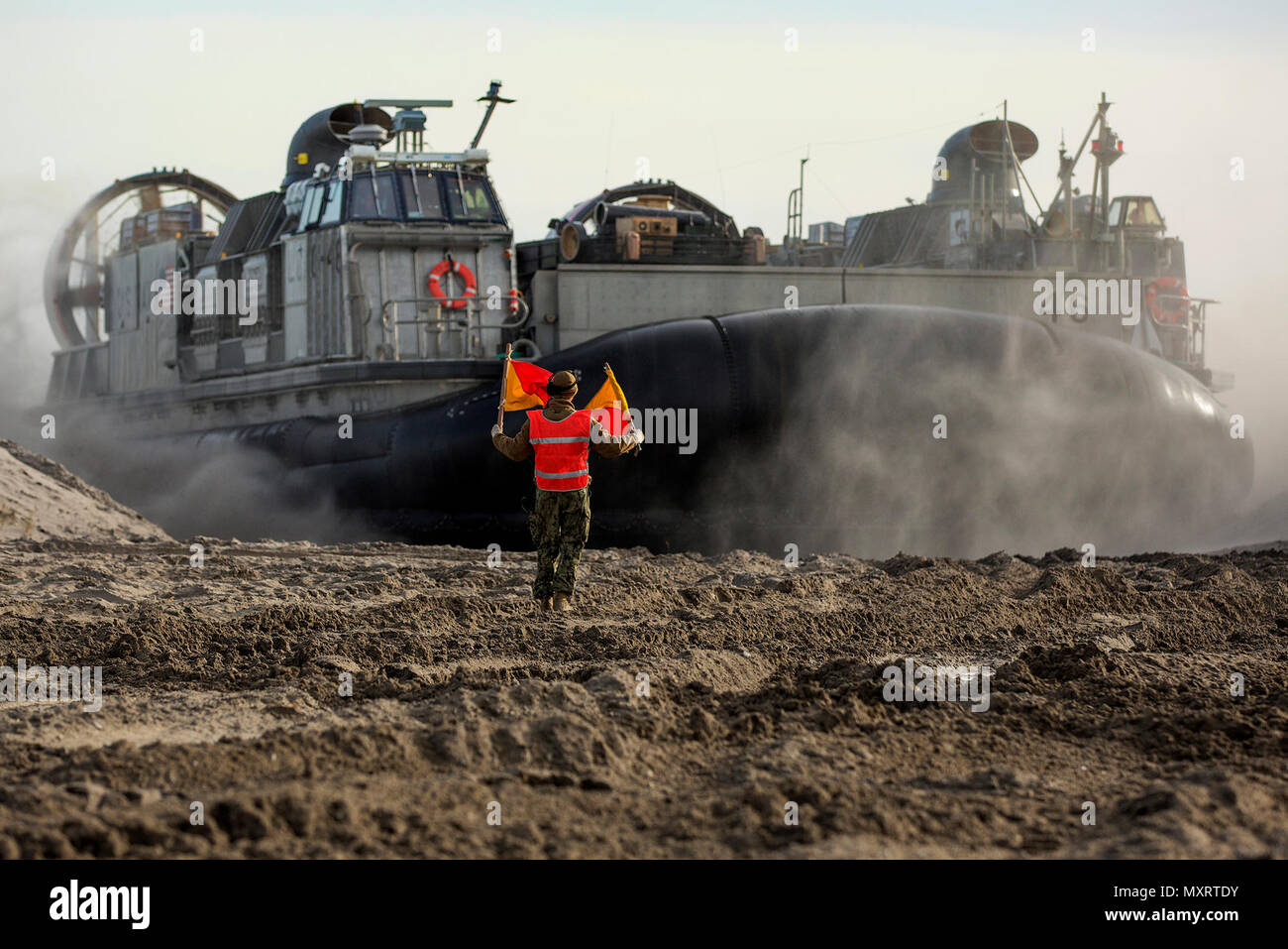 A landing craft air cushion hovercraft arrives on Onslow Beach, North ...