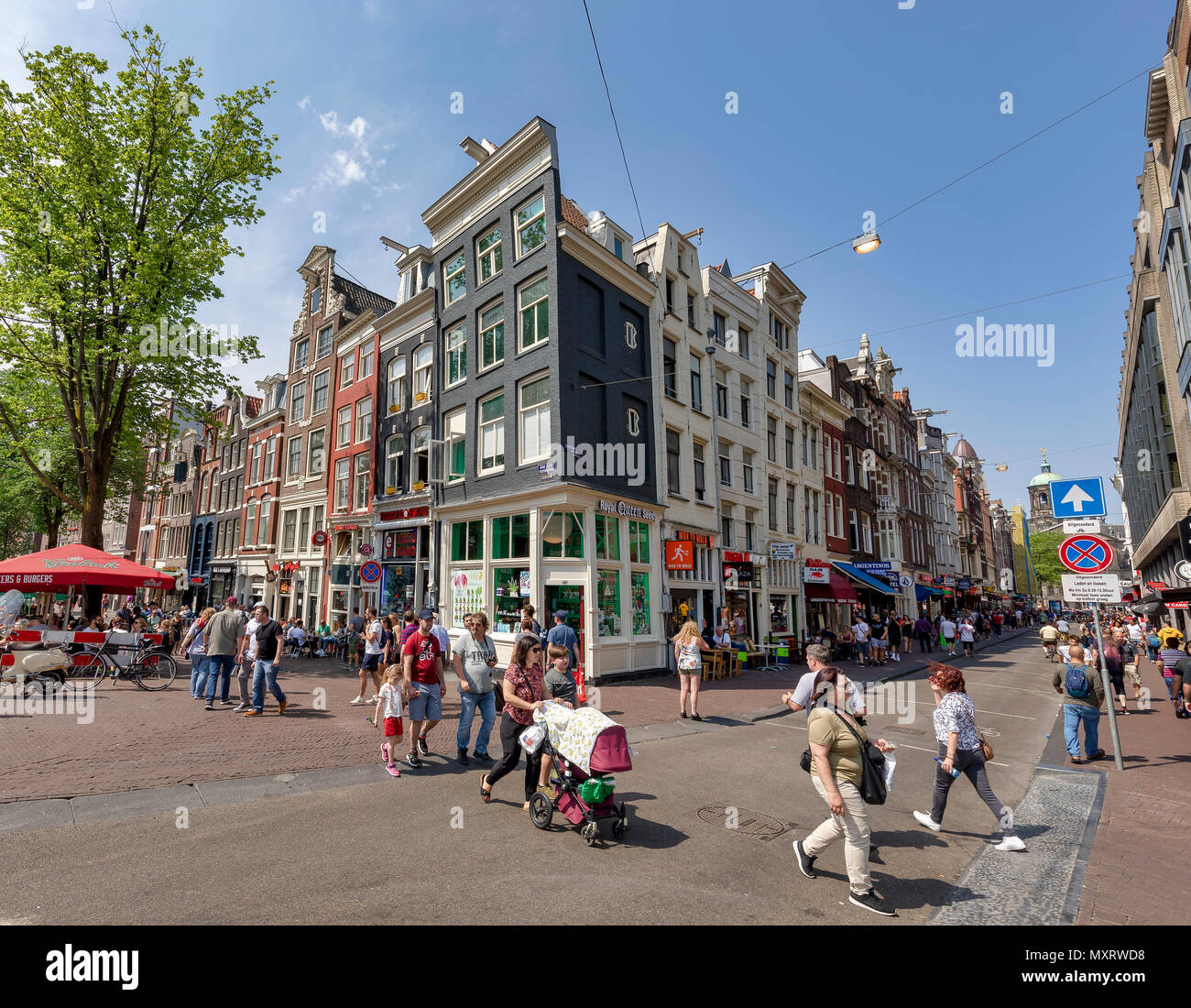 AMSTERDAM, NETHERLANDS - MAY 27: Pedestrians cross over the Damstraat ...