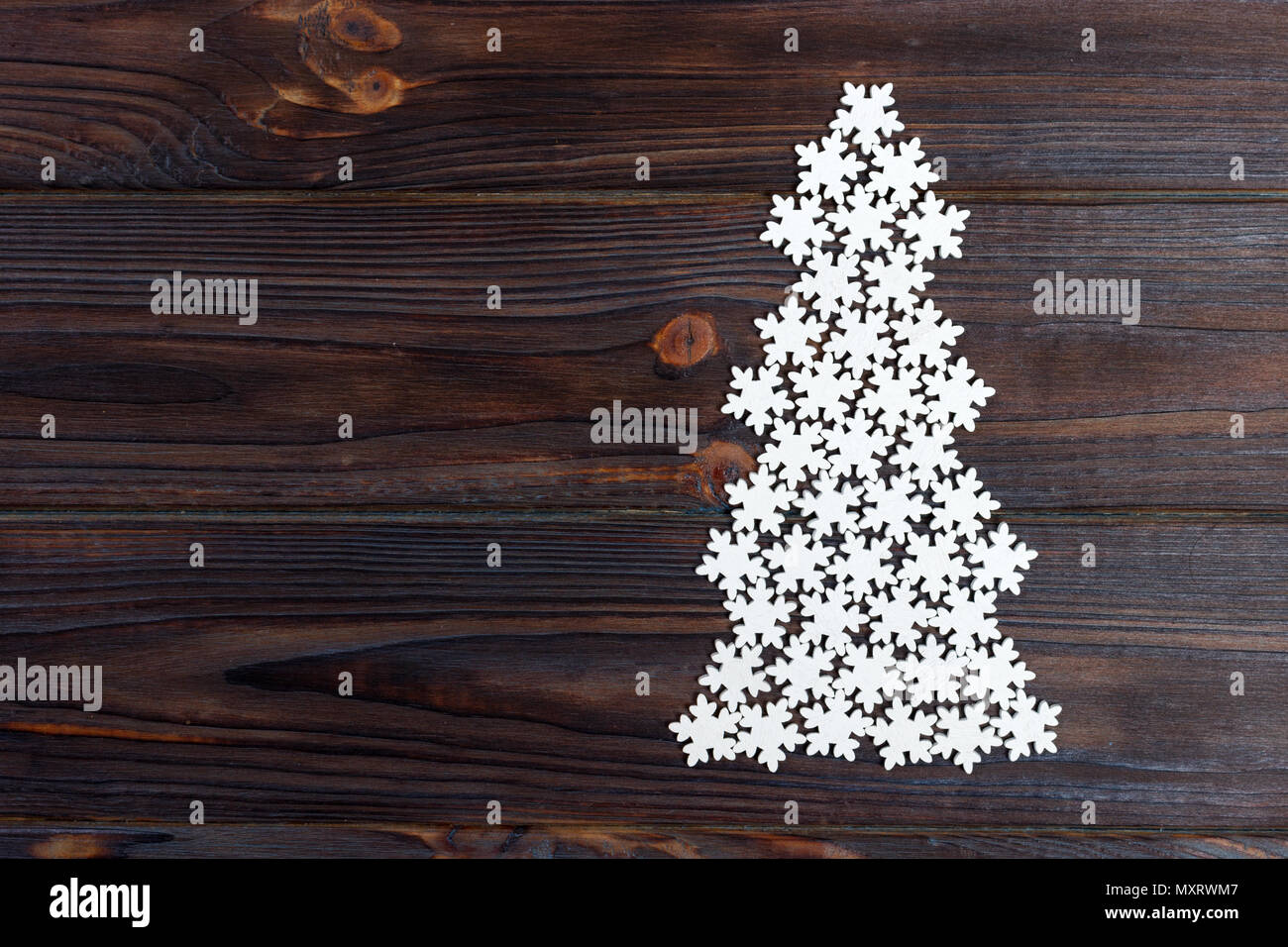 Christmas tree is made of white decorative wooden snowflakes Stock ...