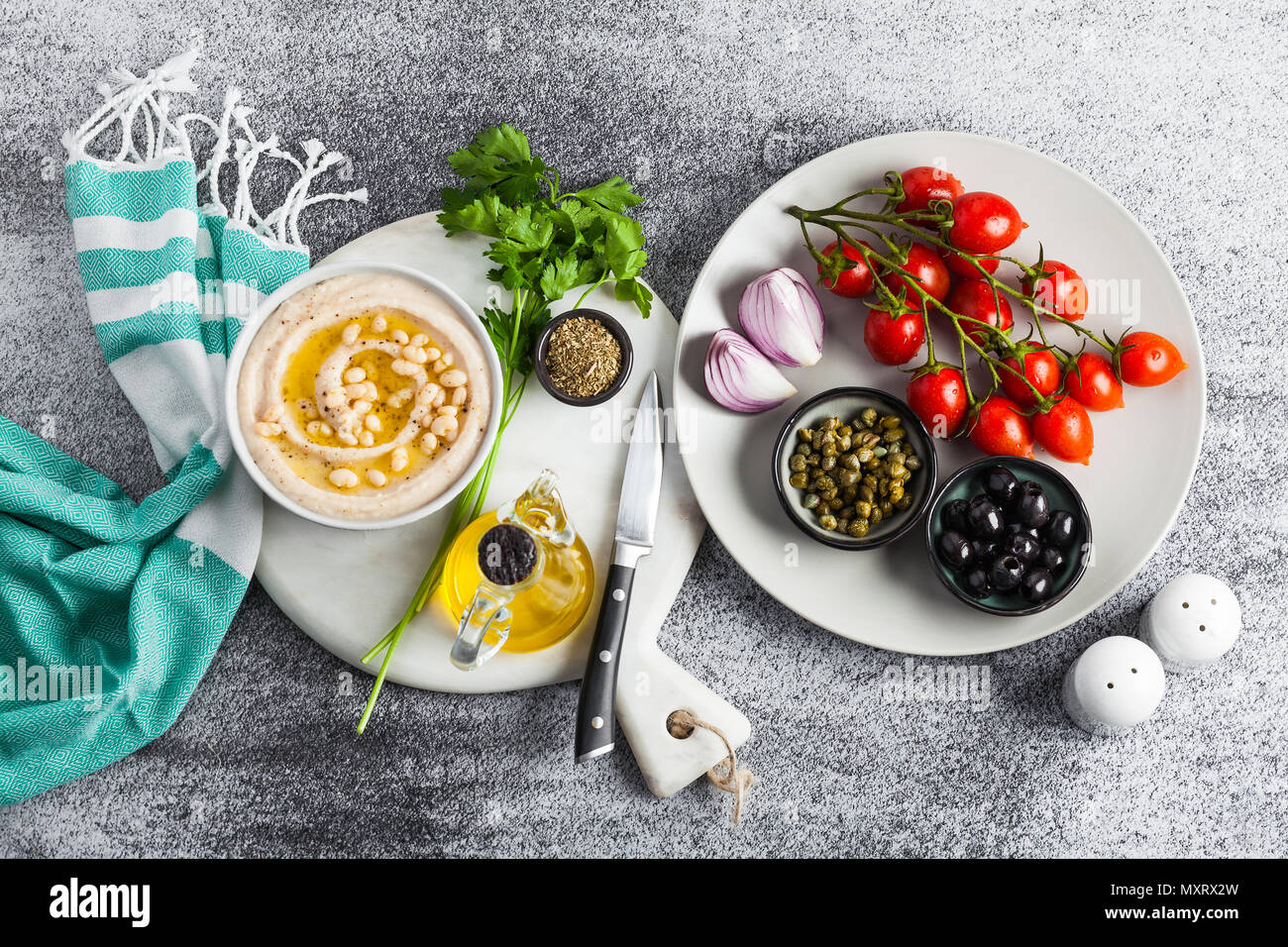 hummus and fresh summer ingredients for cooking vegetarian food on the ...