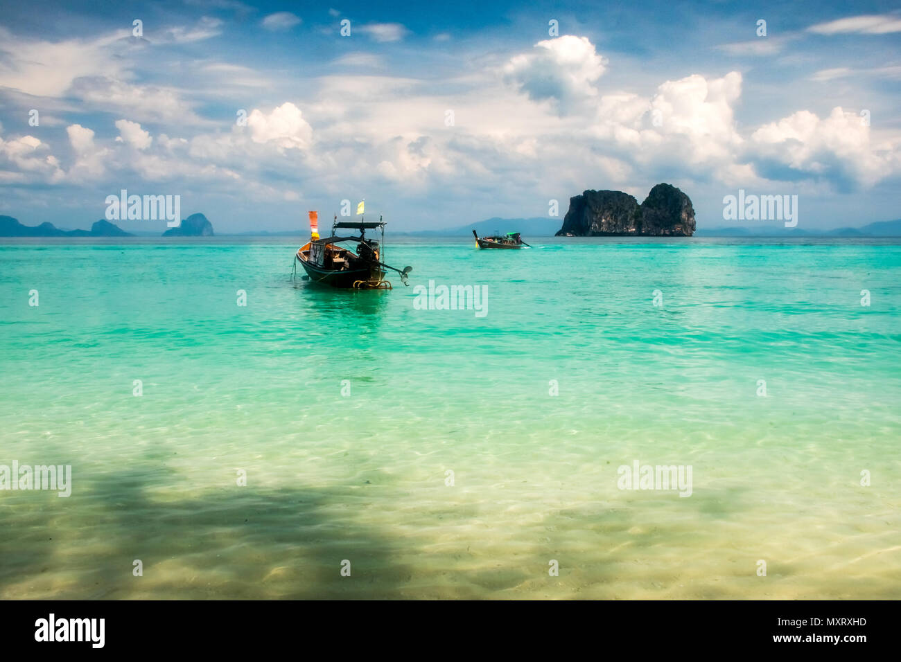 Beautiful beach, traditional long tail boat and crystal clear sea in ...