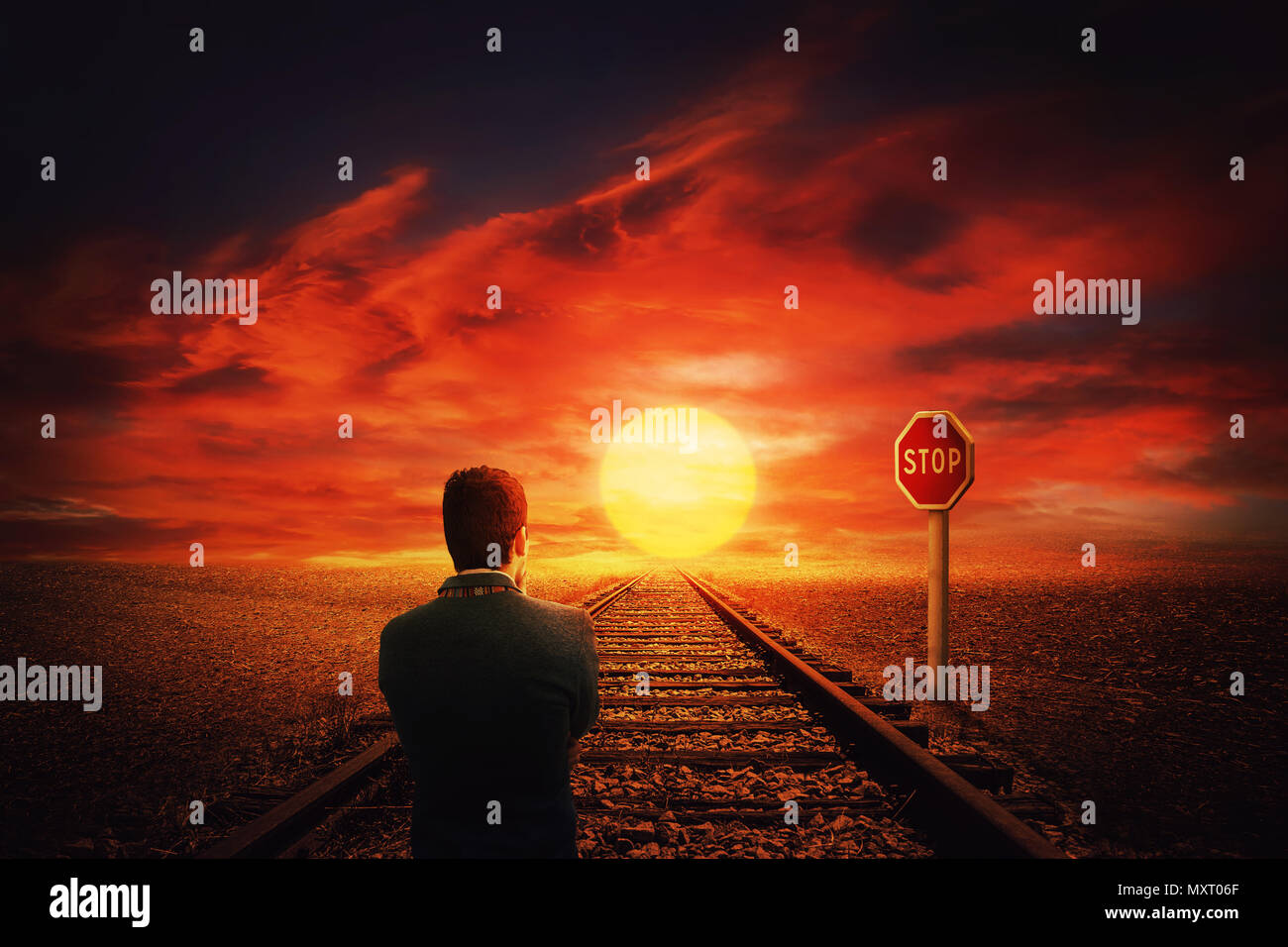 Surreal view as a man walking on a railroad along desert in front of a ... Surreal view as a man walking on a railroad along desert in front of a ...