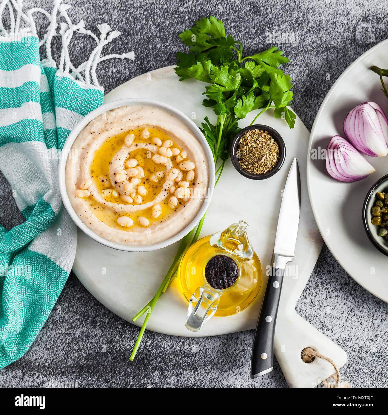 hummus and fresh summer ingredients for cooking vegetarian food on the ...