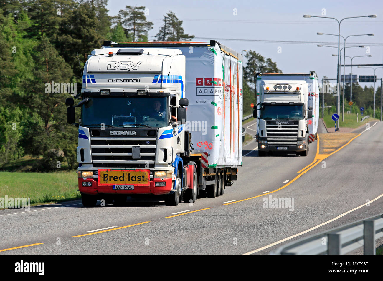 Fleet of two Scania semi trucks haul Cramo Adapteo Modular Space units ...