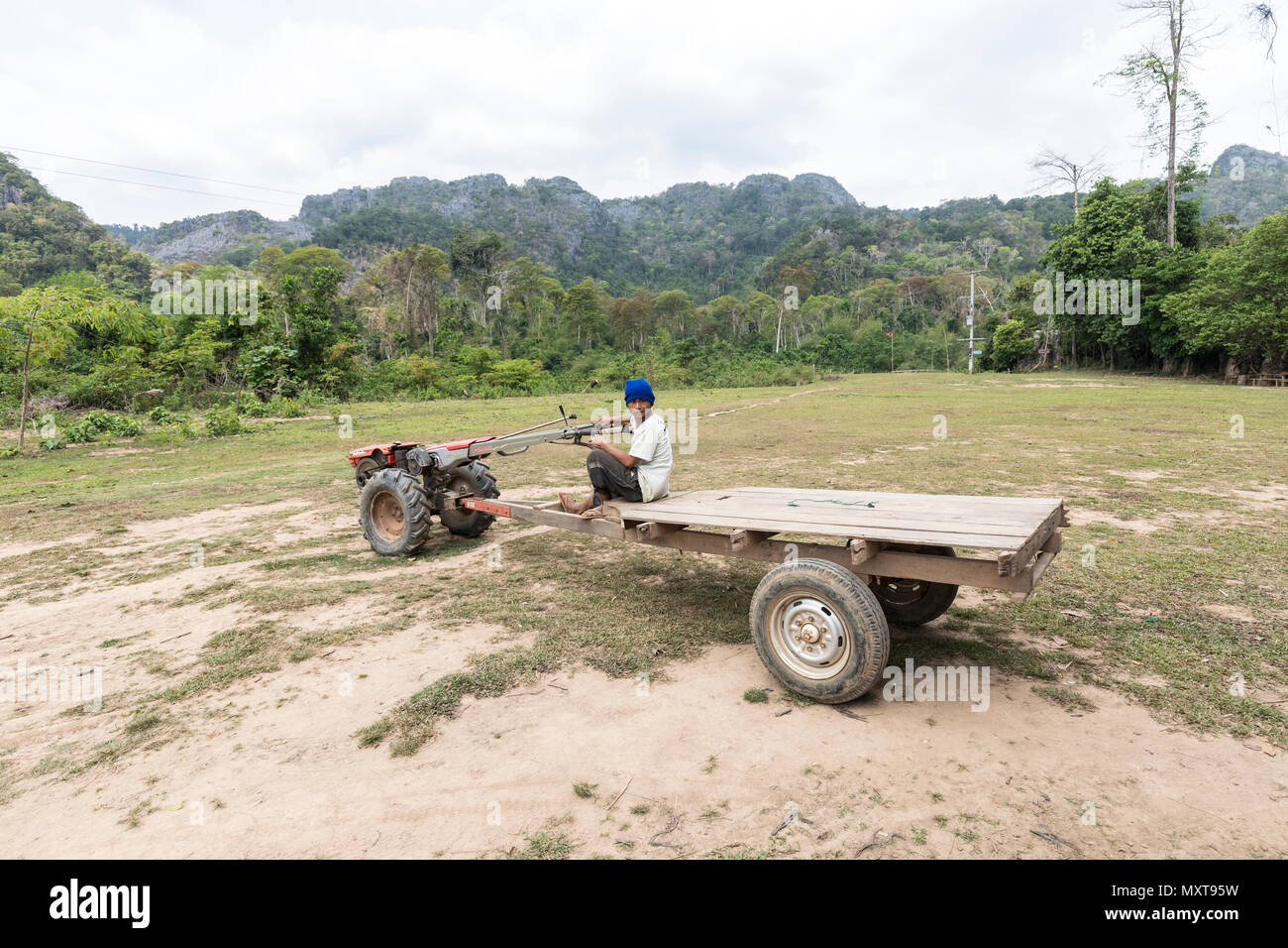 Tractor and trailer used for transport, with farmer, Nong Ping, a rural ...