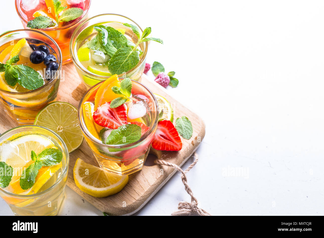 Lemonade set. Cold summer drink assortment. Lemonade, mojito and berry ...