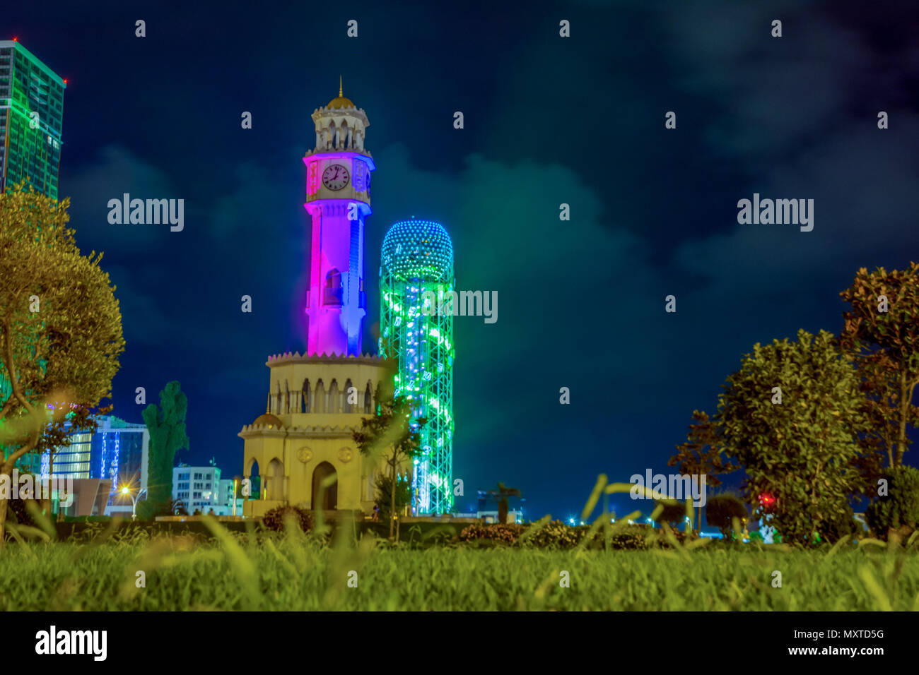 Alphabet and clock tower at night time, Batumi, Georgia Stock Photo - Alamy
