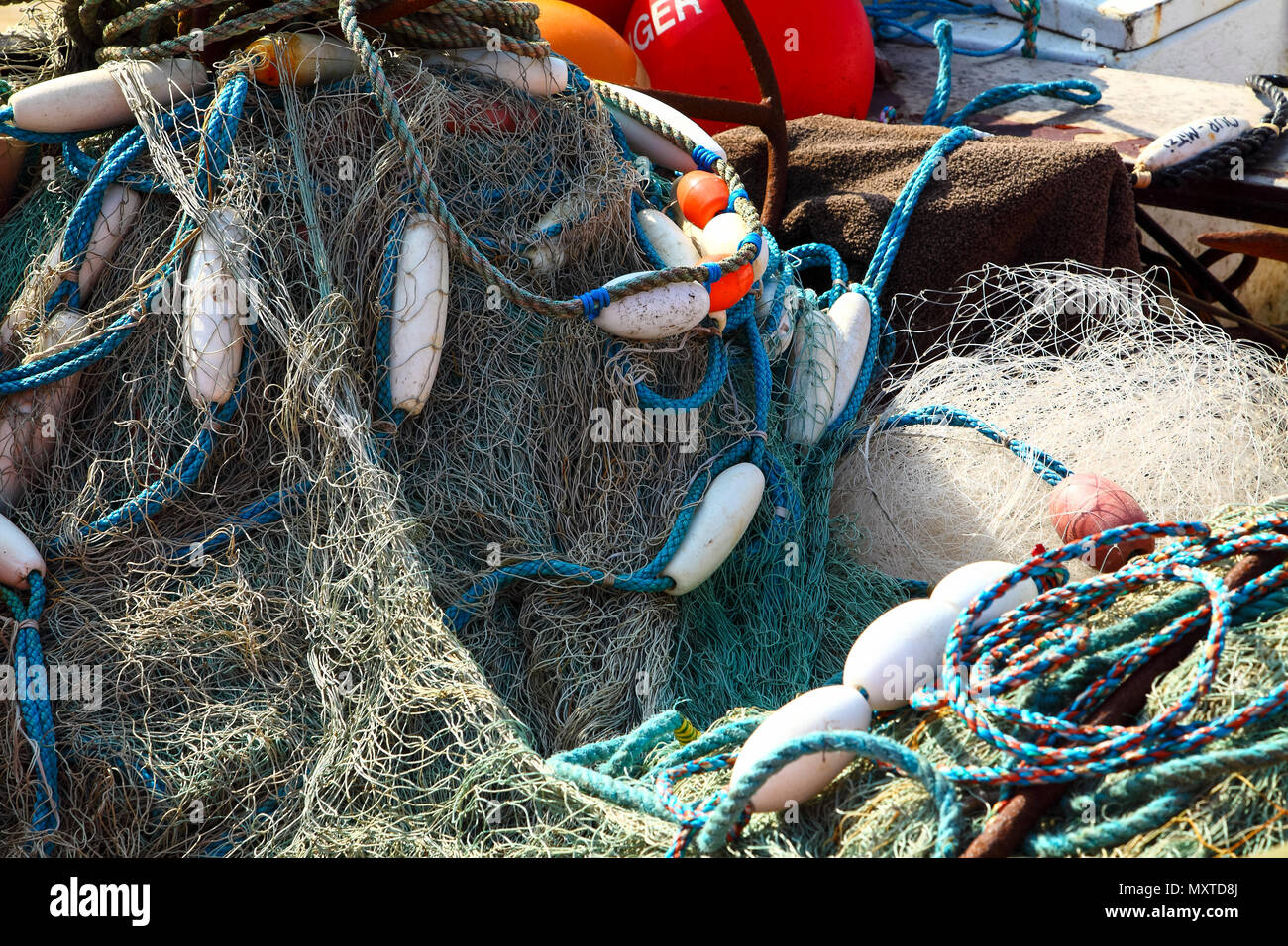 Sea fishing nets drying on a boat at filey bay england UK Stock Photo ...