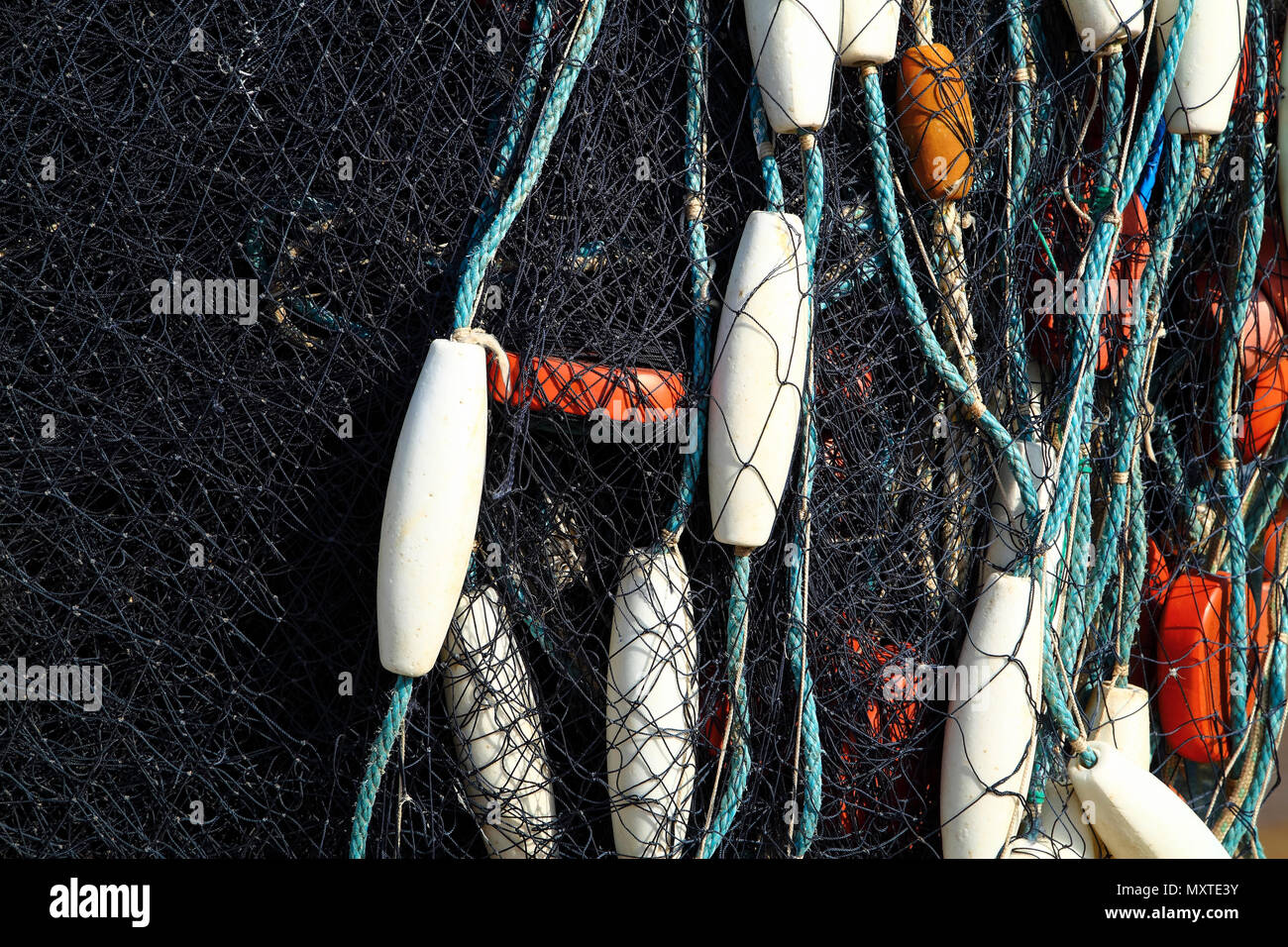 Sea fishing nets drying on railings at filey bay england UK Stock Photo ...