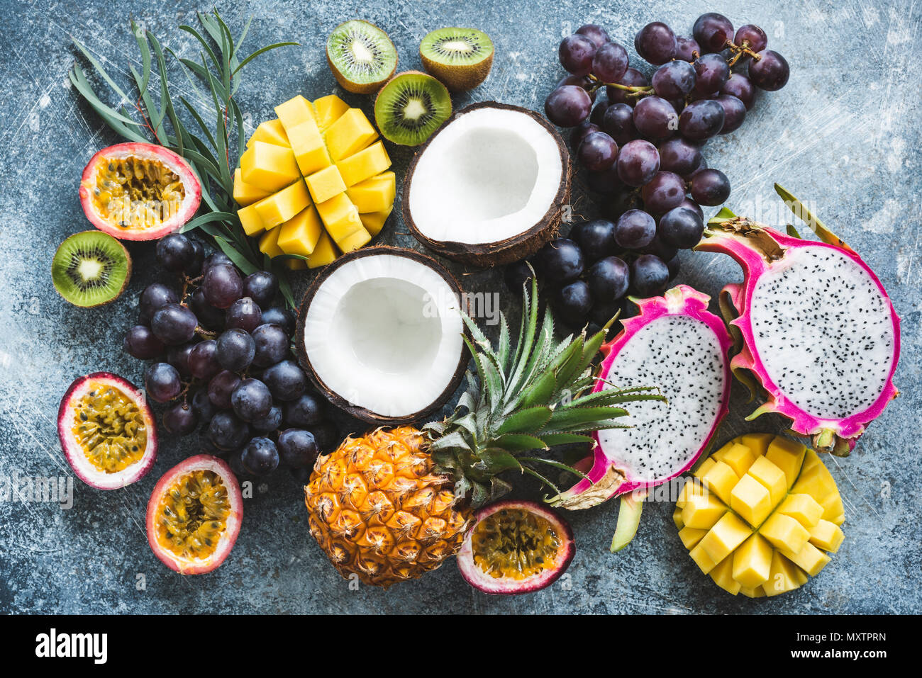 Assortment of exotic tropical fruits, top view. Passionfruit ...