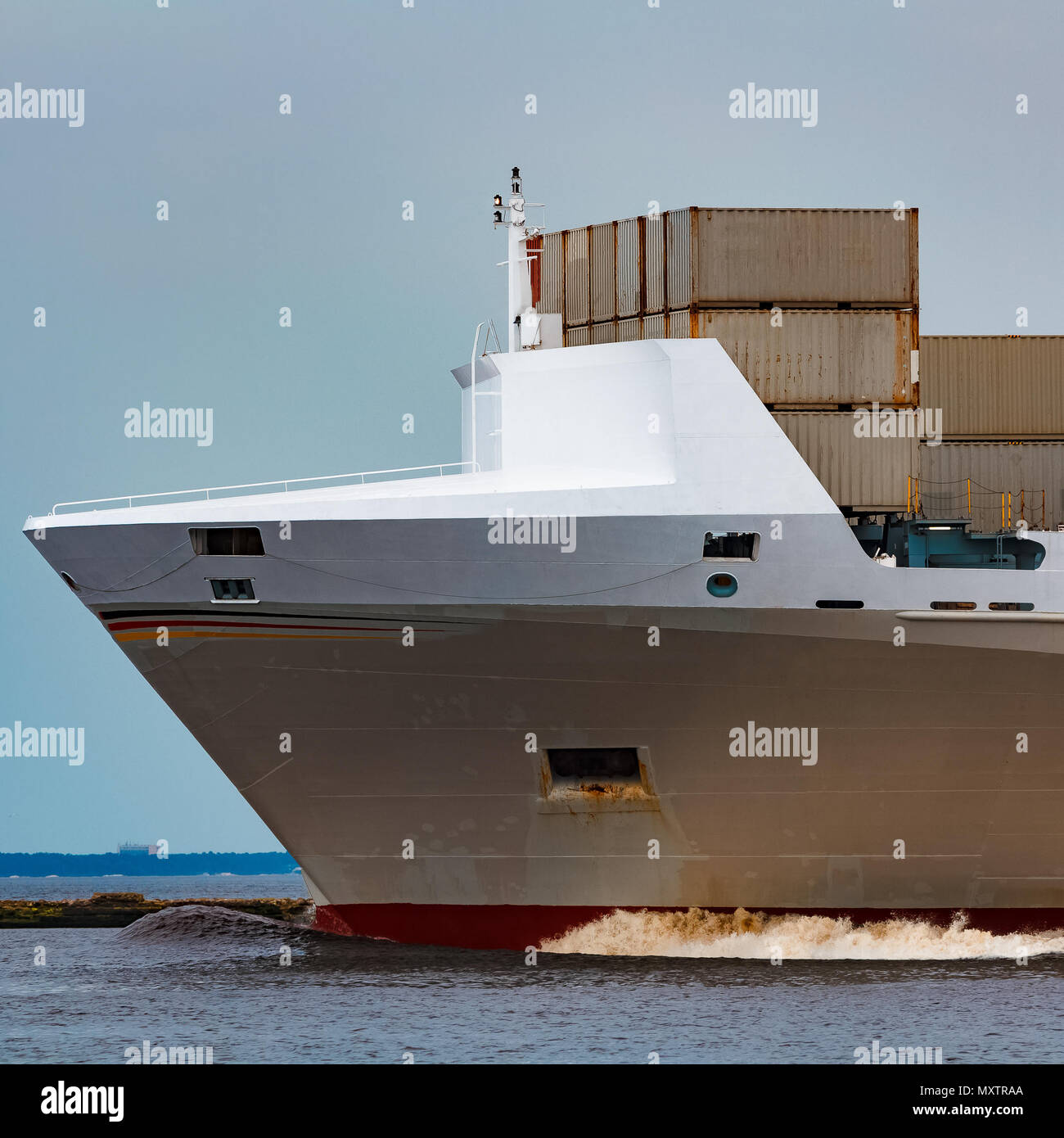 Grey container ship. Logistics and production import Stock Photo - Alamy