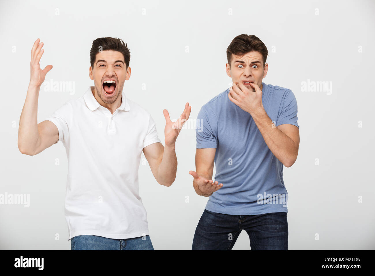 Photo of two emotional men 30s wearing casual t-shirt and jeans ...