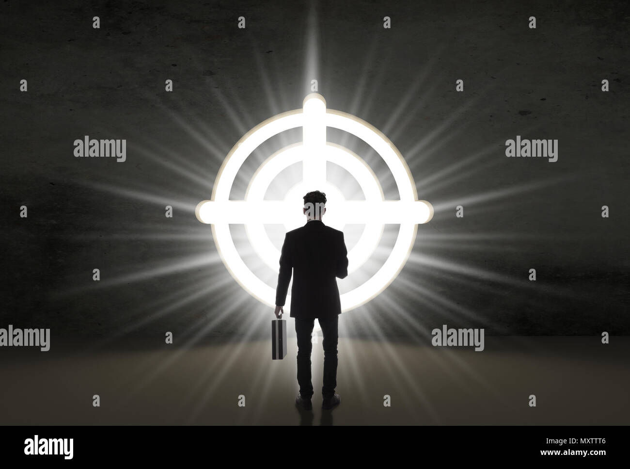Businessman with a bright open target door, conceptual success image ...