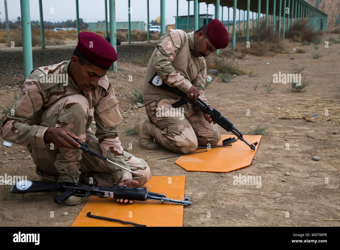 Iraqi soldiers from the Iraqi Army 60th Brigade assemble their AK-47 ...