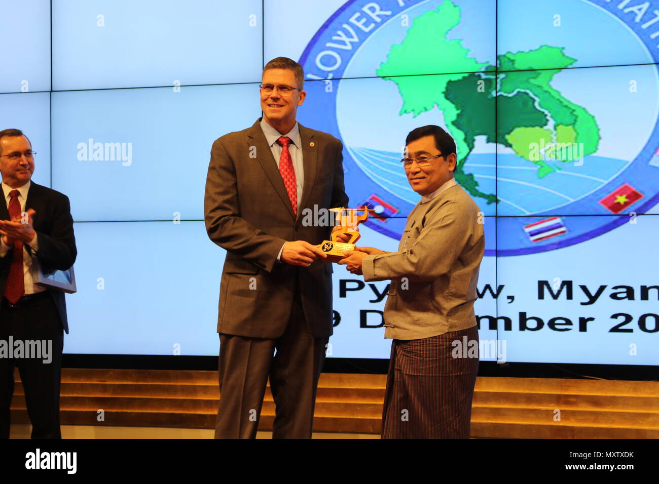 U.S. Army Col. Peter Andrysiak presents Dr. Win Myat Aye, Union ...