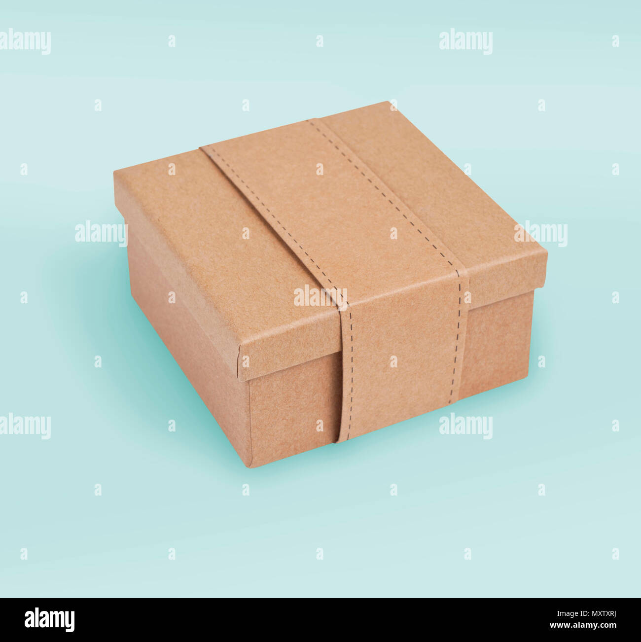 Cardboard box for packaging on a green background Stock Photo - Alamy