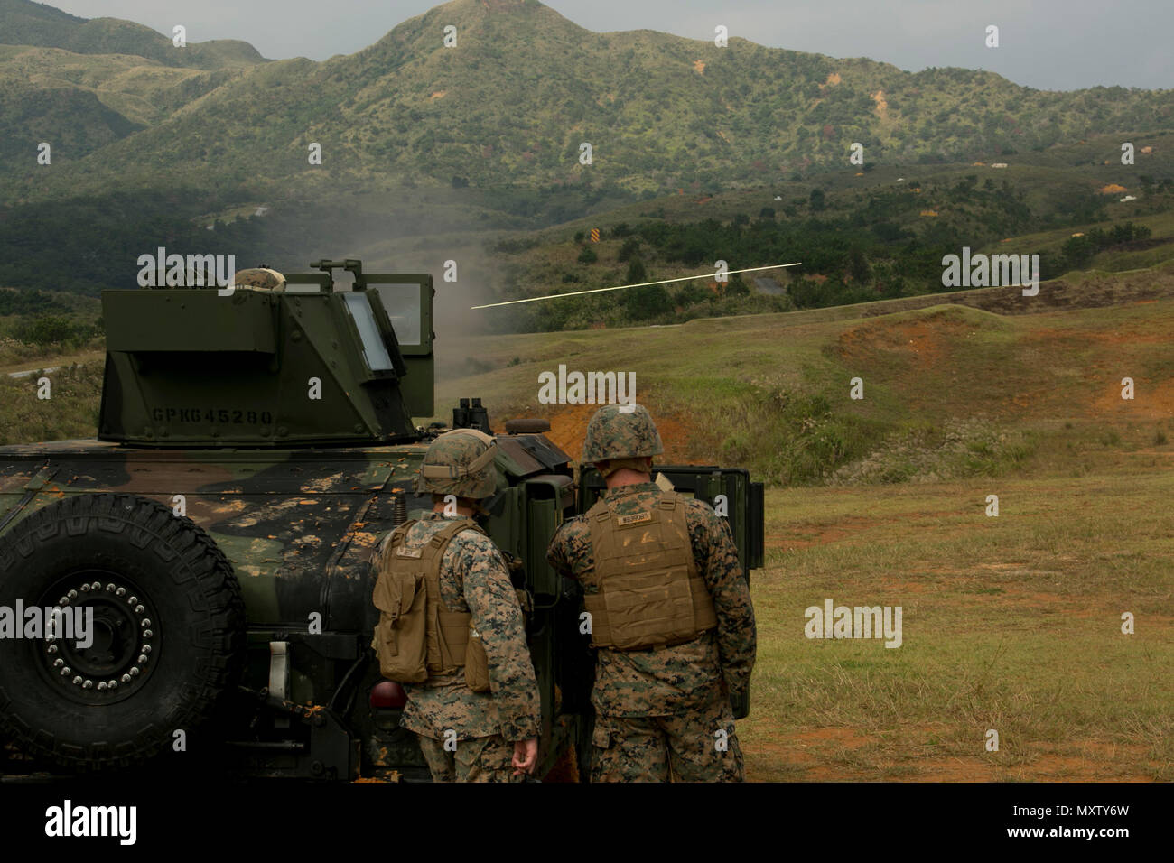 EASTERN TRAINING AREA, OKINAWA, Japan – Marines fire the M2 .50 caliber ...