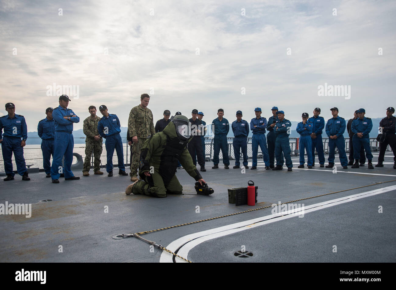 Members of Explosive Ordnance Disposal Mobile Unit (EODMU) 5 conduct ...