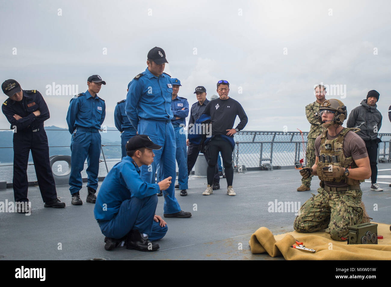 A member of Explosive Ordnance Disposal Mobile Unit (EODMU) 5 conducts ...