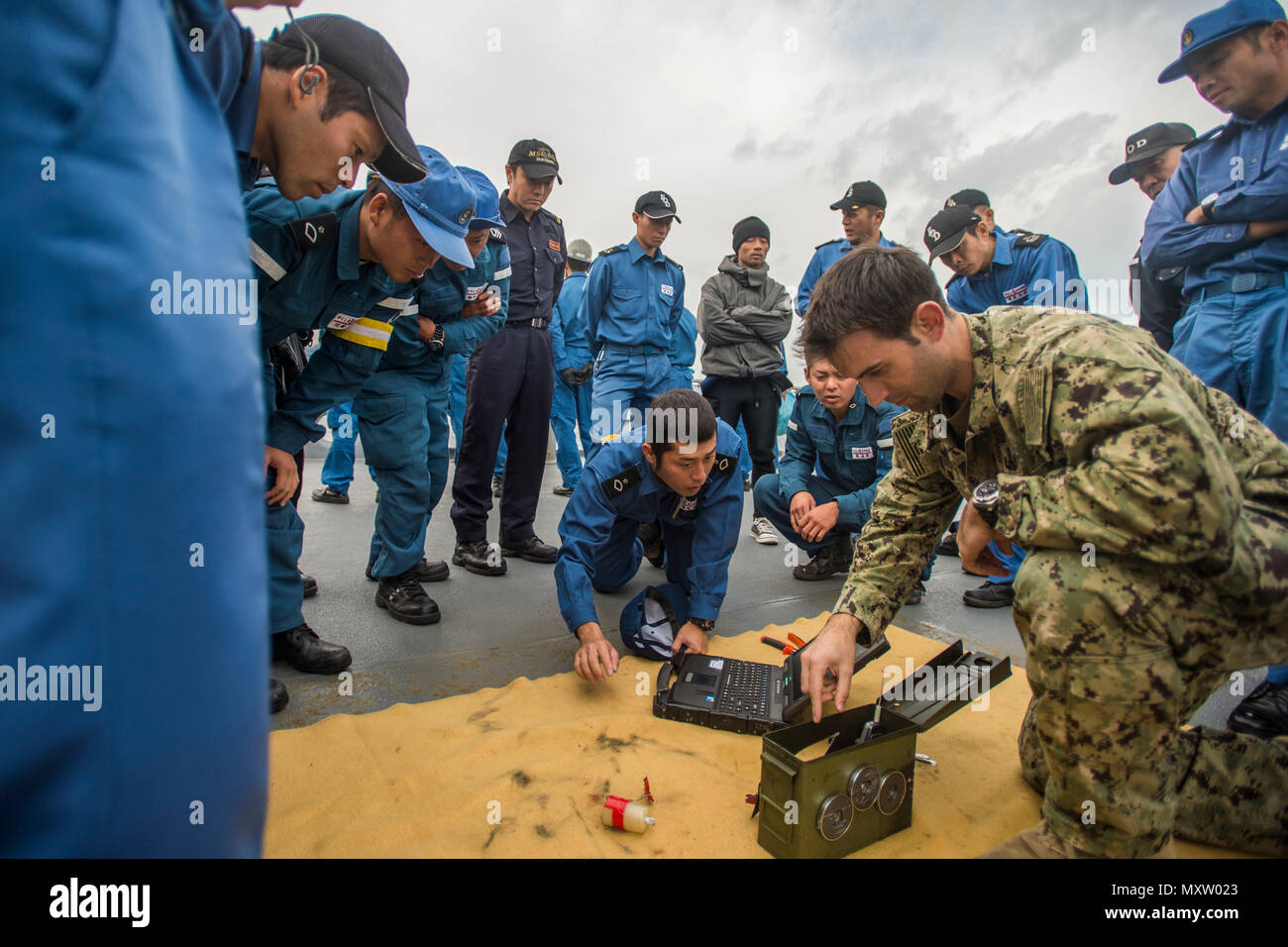 A member of Explosive Ordnance Disposal Mobile Unit (EODMU) 5 conducts ...