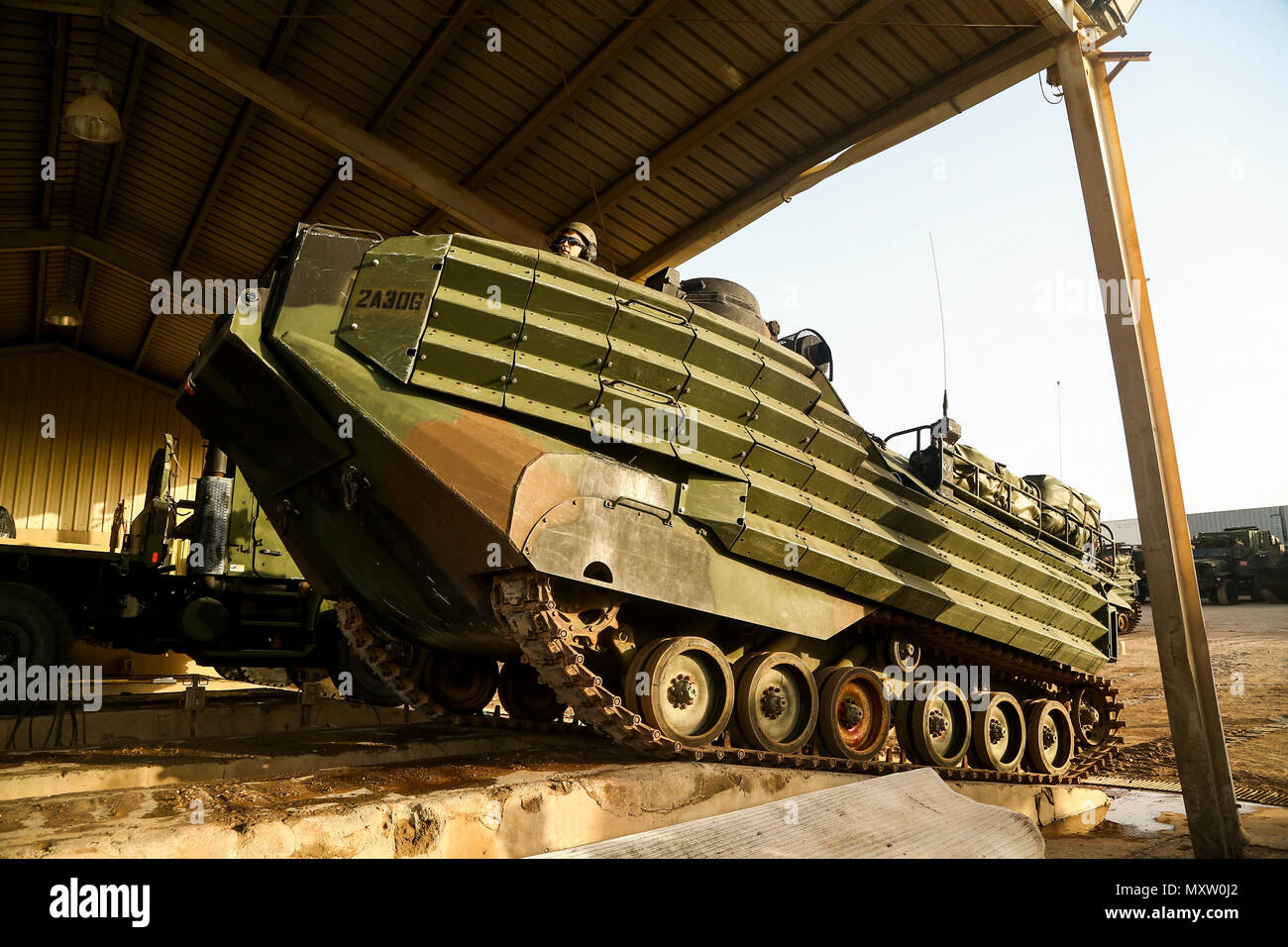 A U.S. Marine with 22nd Marine Expeditionary Unit (MEU) drives an ...