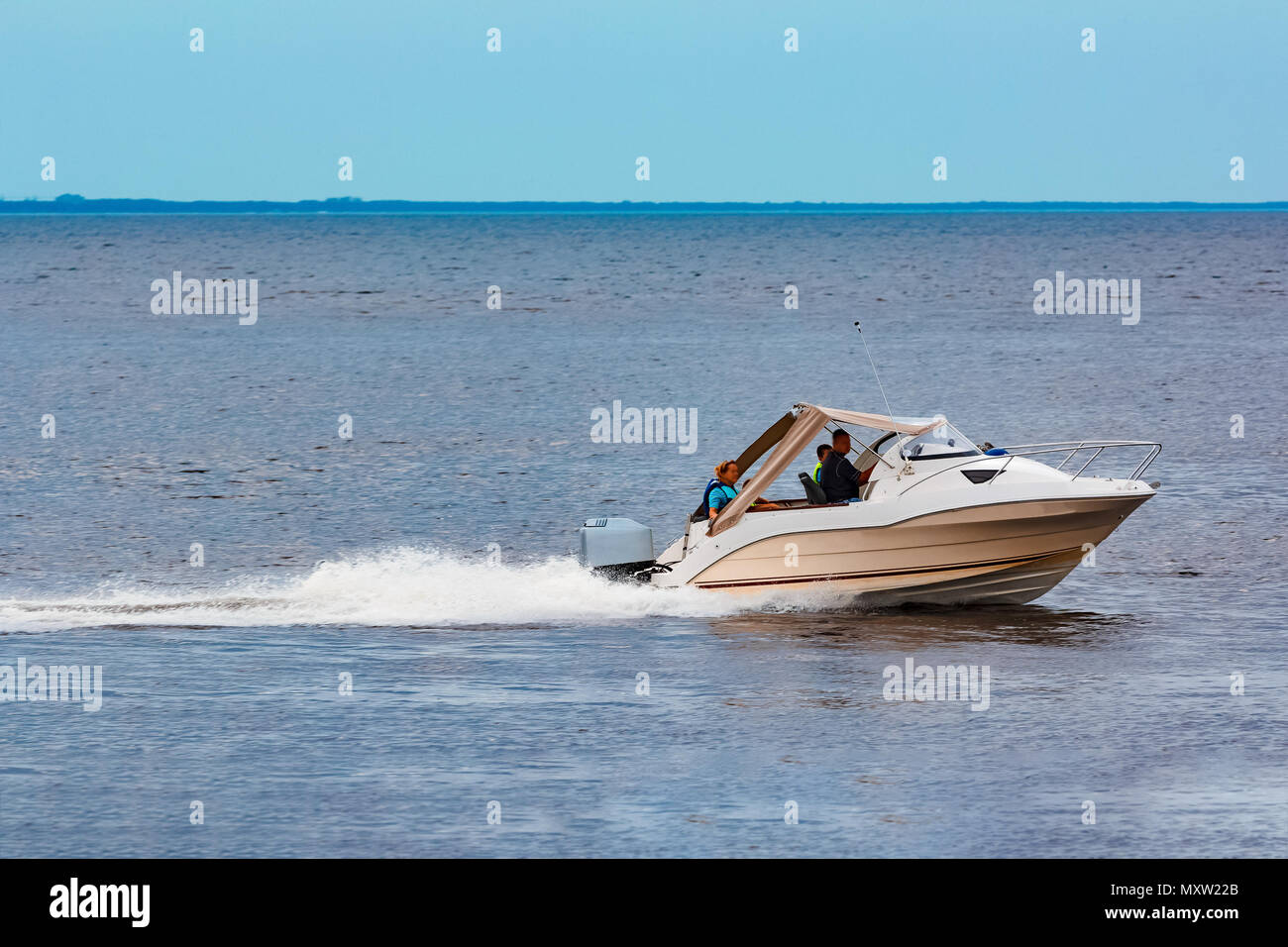 White speed boat moving fast to the Baltic sea. Water sport Stock Photo ...