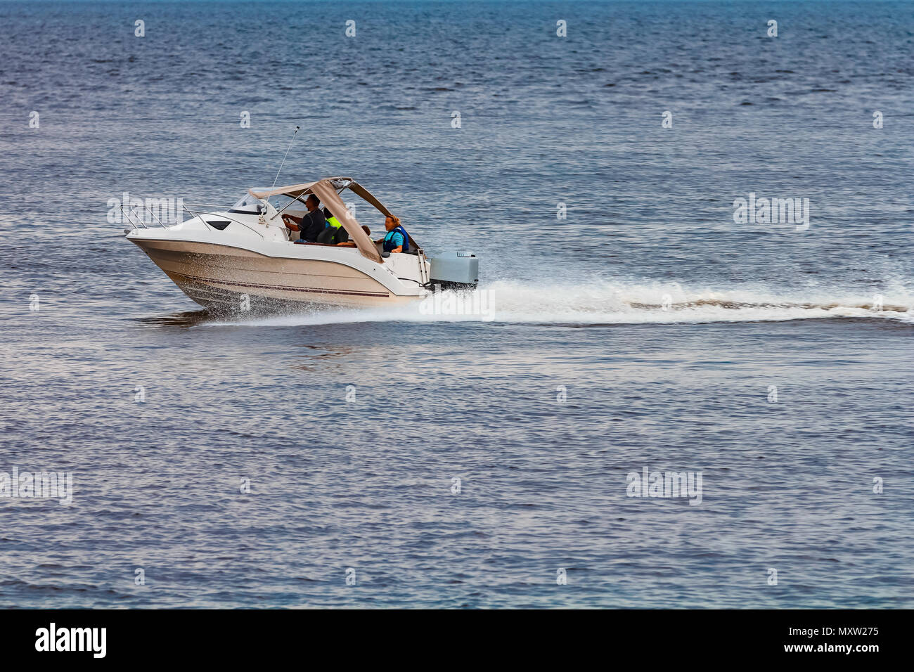 White speed boat moving fast to the Baltic sea. Water sport Stock Photo ...