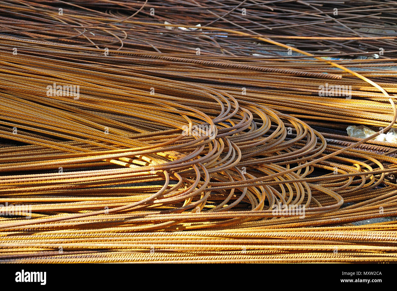 long rusty iron construction rods in a heap Stock Photo - Alamy