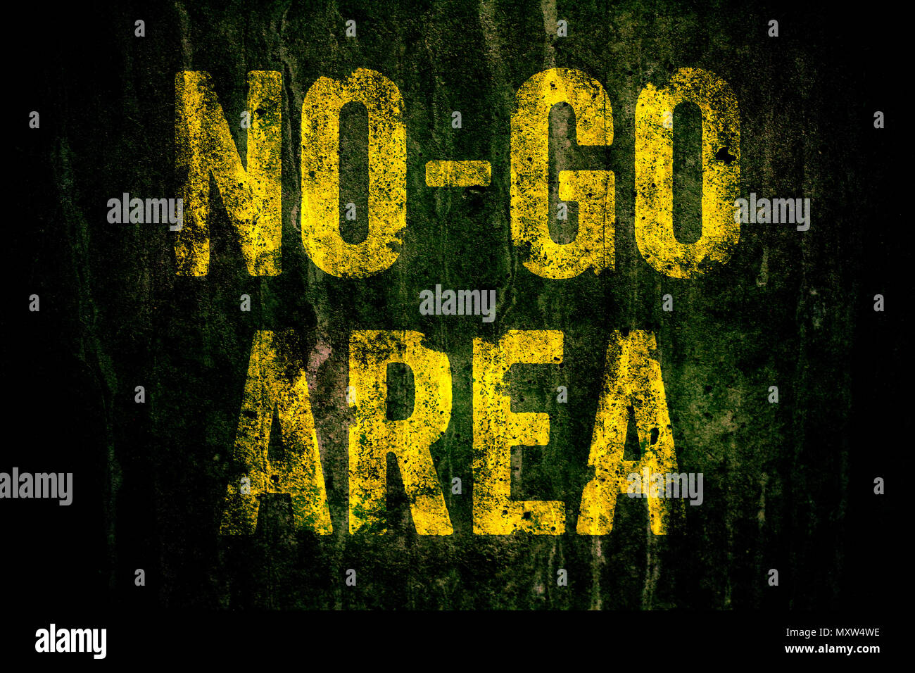 “No-Go Area” warning sign in yellow letters painted over dark grungy ...