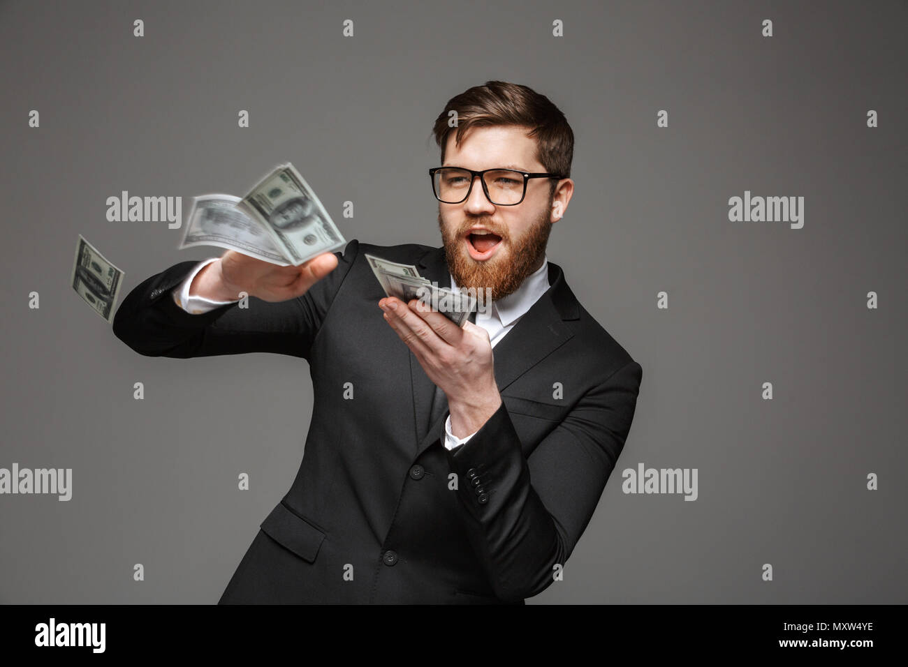 Happy businessman throwing out money hi-res stock photography and ...