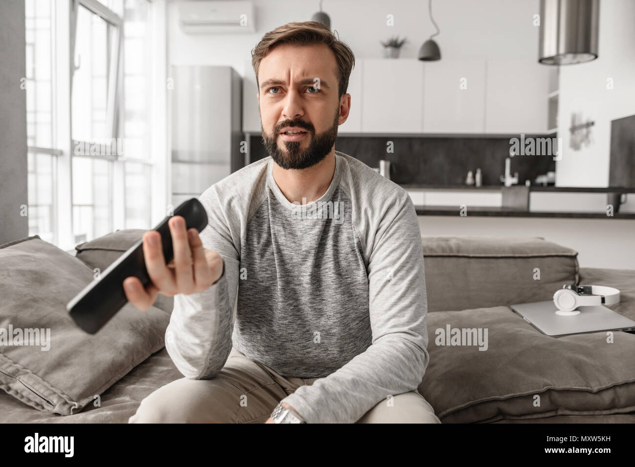 Remote control television frustrated hi-res stock photography and ...