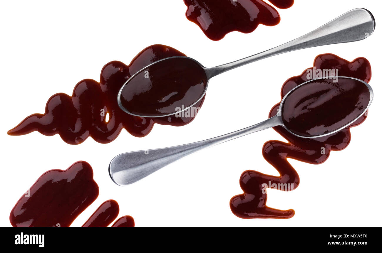 Barbecue sauce. Splashes and spilled grill sauce with spoon isolated on ...