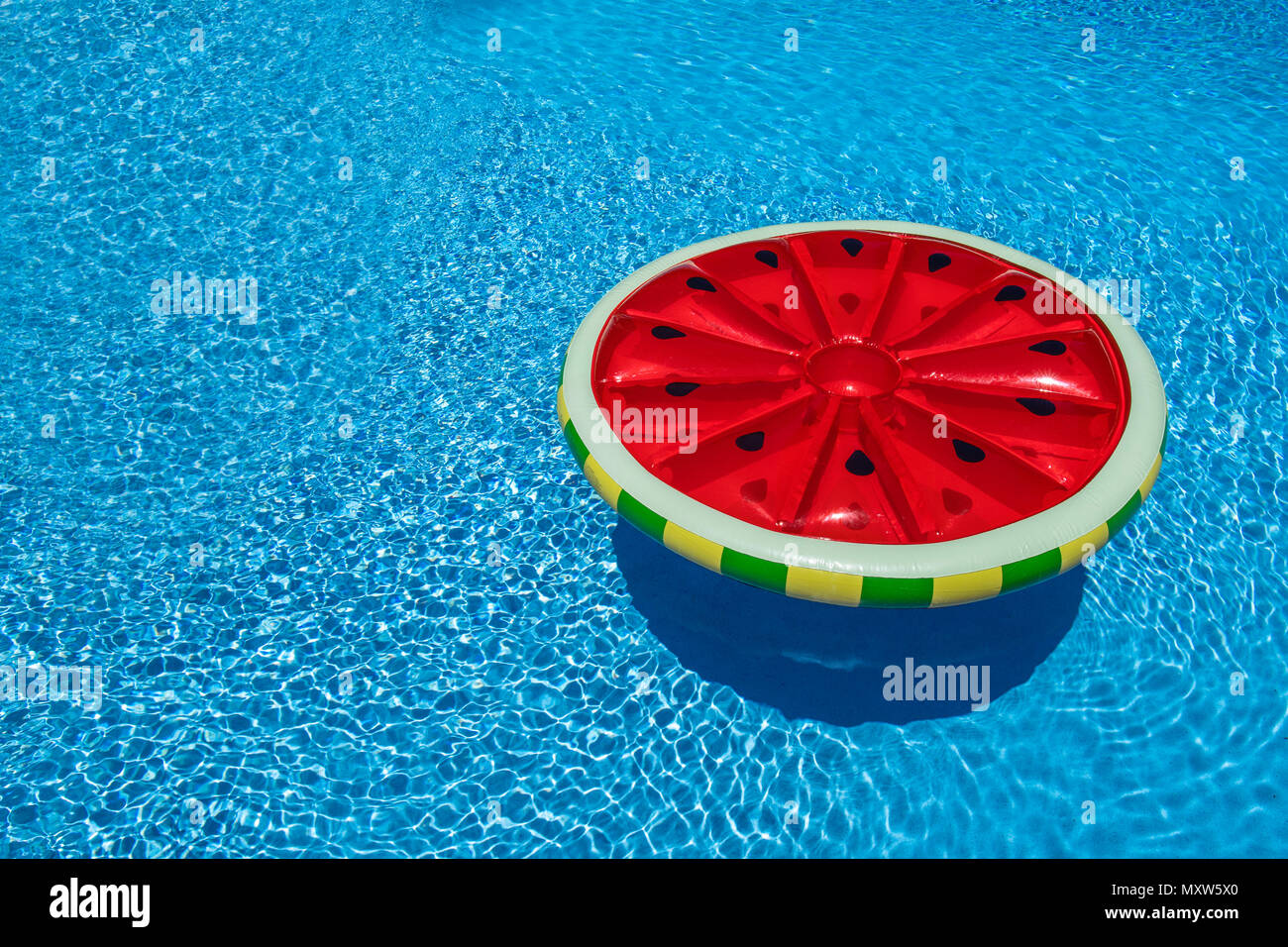 Watermelon float in the pool Stock Photo - Alamy