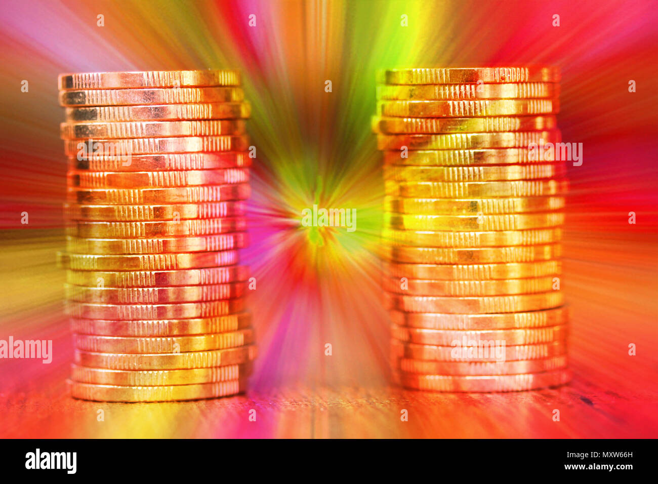 Two stacks of gold money coins coin in pile on blurred colorful fantasy ...