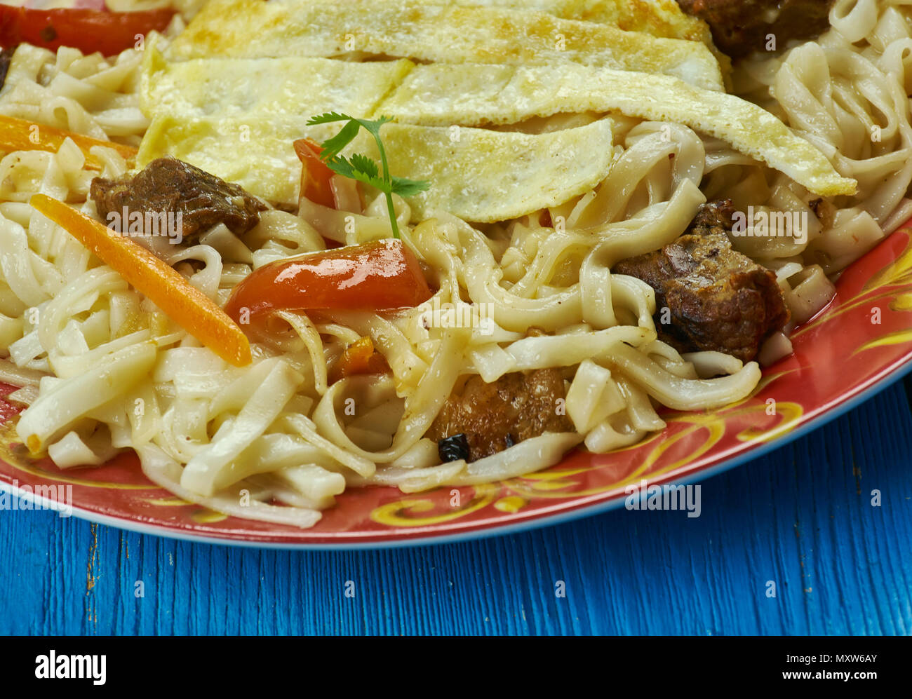 Uzbek Qovurma lagmon , Traditional assorted dishes, Top view. Central ...