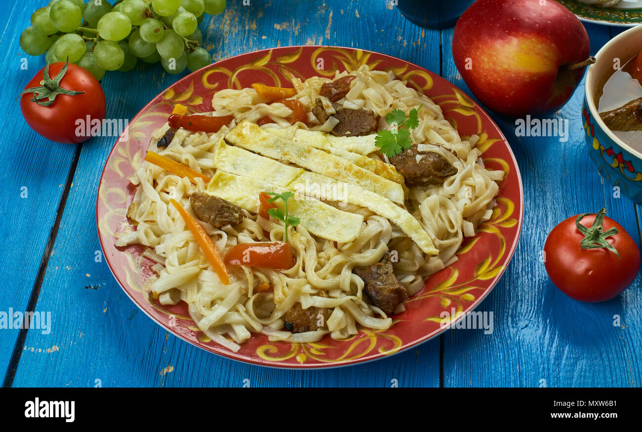 Uzbek Qovurma lagmon , Traditional assorted dishes, Top view. Central ...
